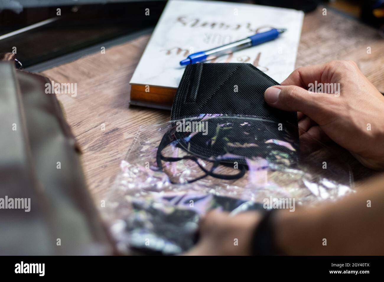 Desktop with face masks on top and office elements Stock Photo - Alamy