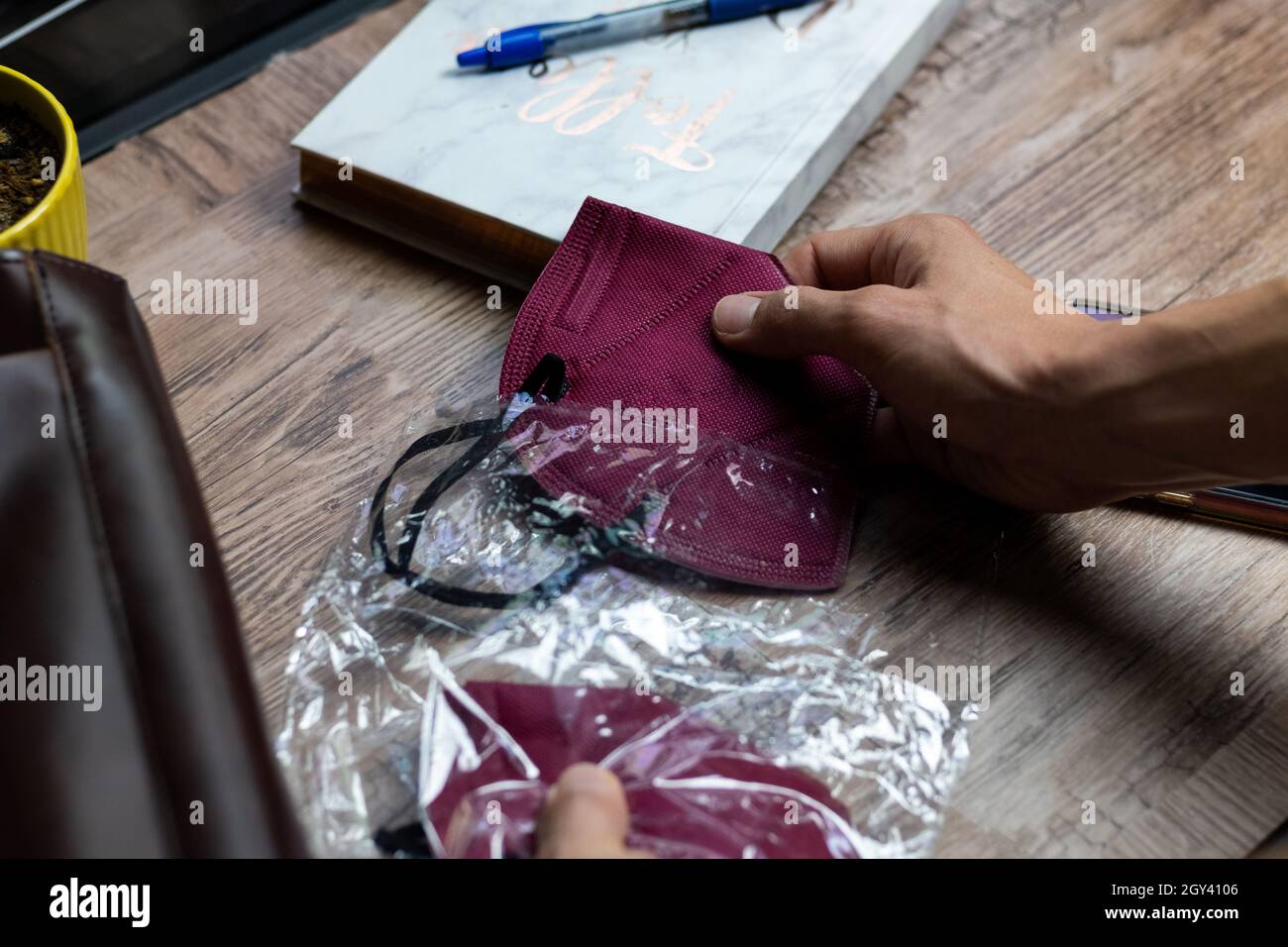 Desktop with face masks on top and office elements Stock Photo - Alamy