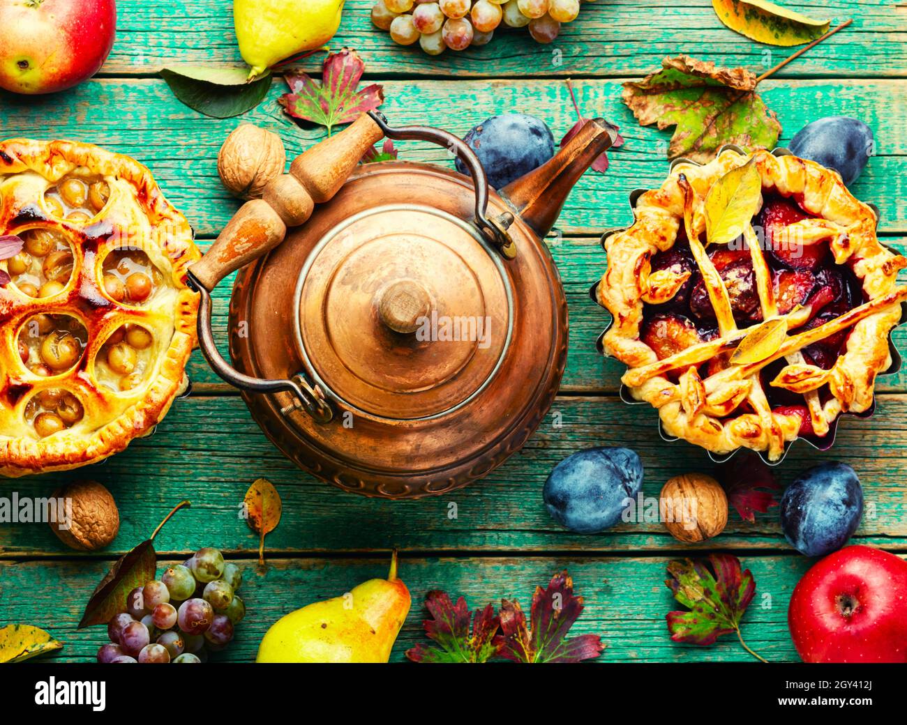 Set of autumn fruit pies.Pie of apples,pears,grapes and plums Stock ...