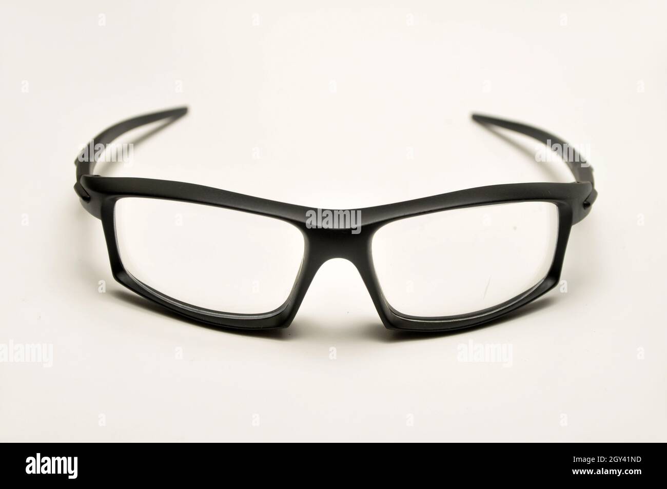 Reading glasses with black frames on a white background Stock Photo - Alamy