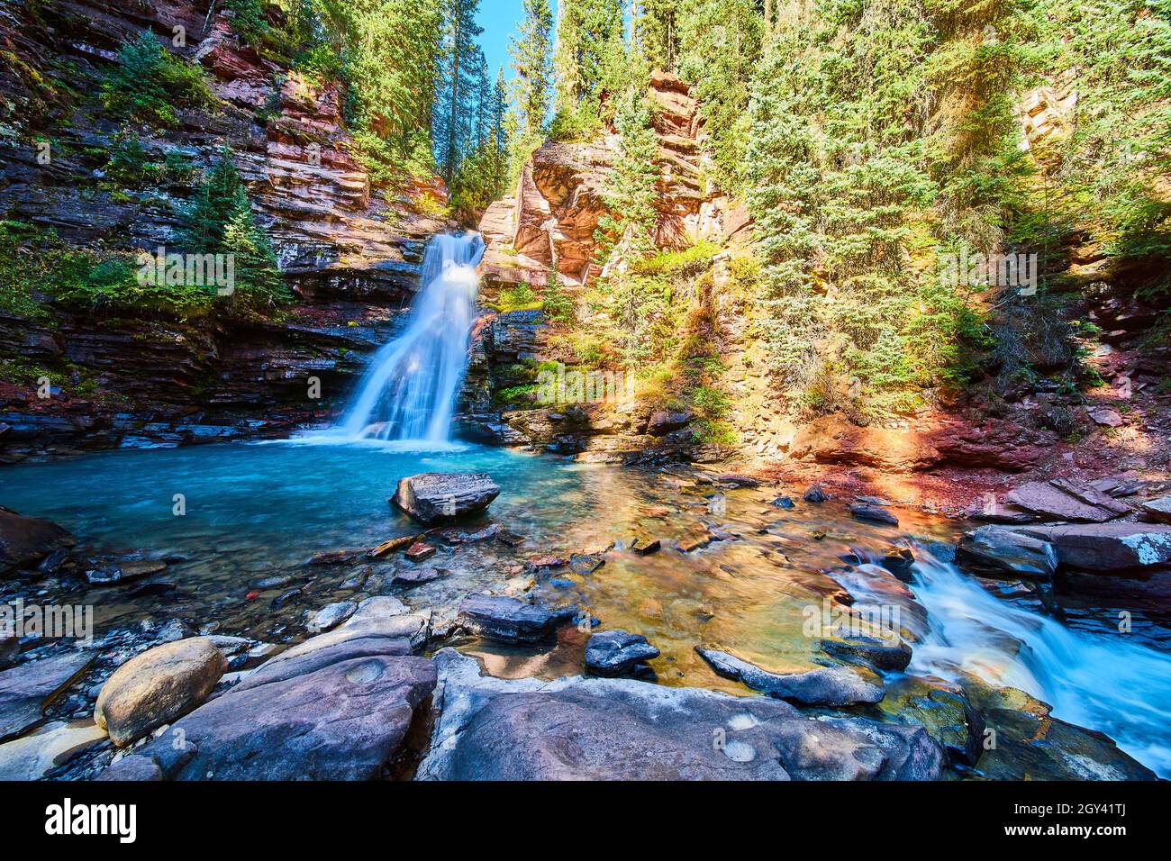 River rocks and canyon with blue vibrant waterfall Stock Photo - Alamy