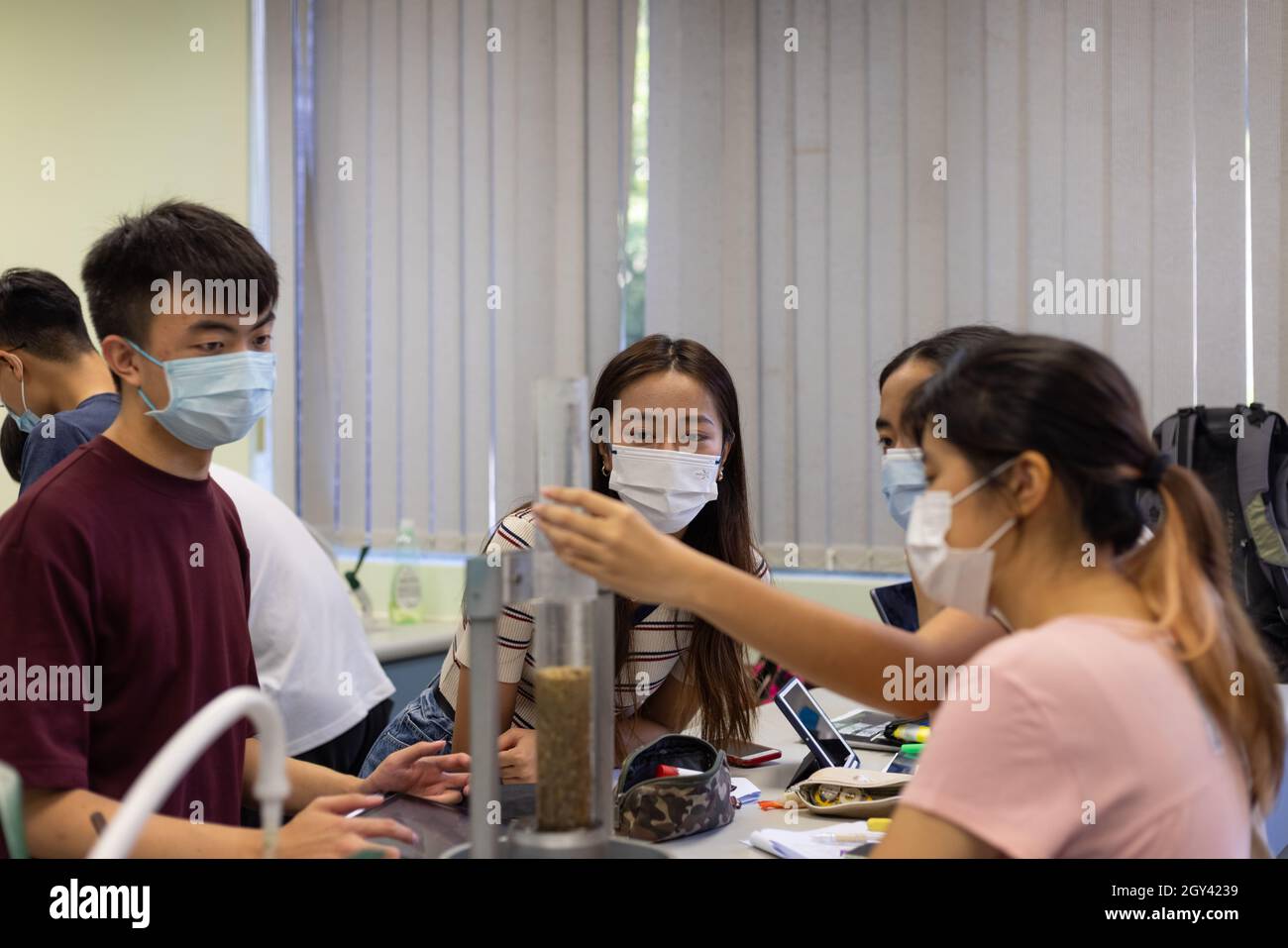 10 4 2021 Group of young students do hydraulic test of soil samples ...