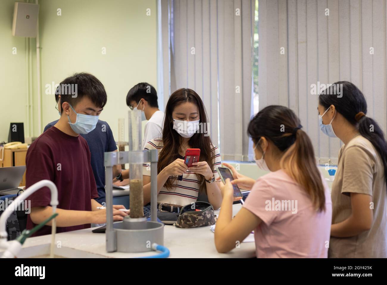 10 4 2021 Group of young students do hydraulic test of soil samples ...