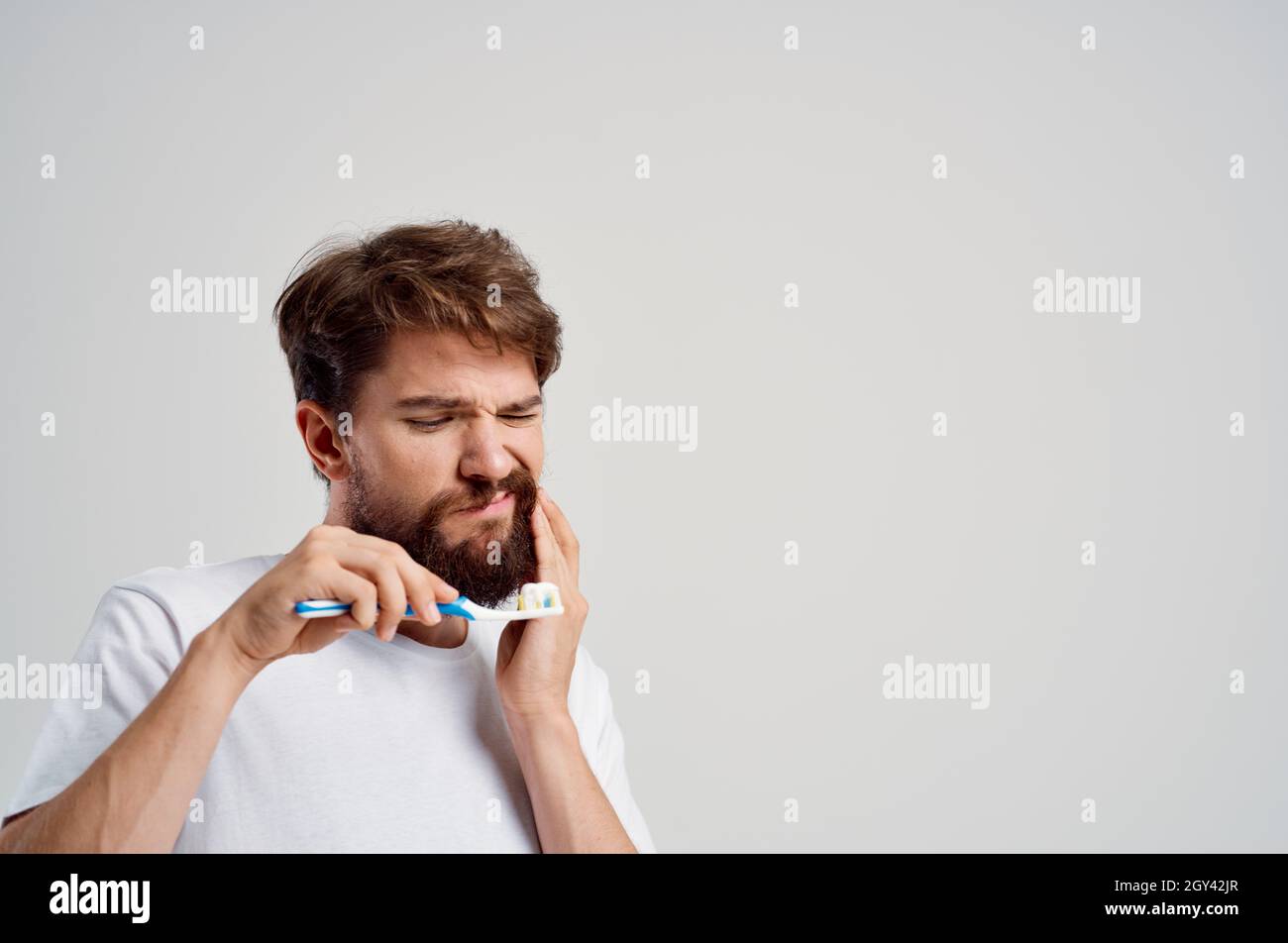 emotional man dental care dentistry toothache light background Stock ...