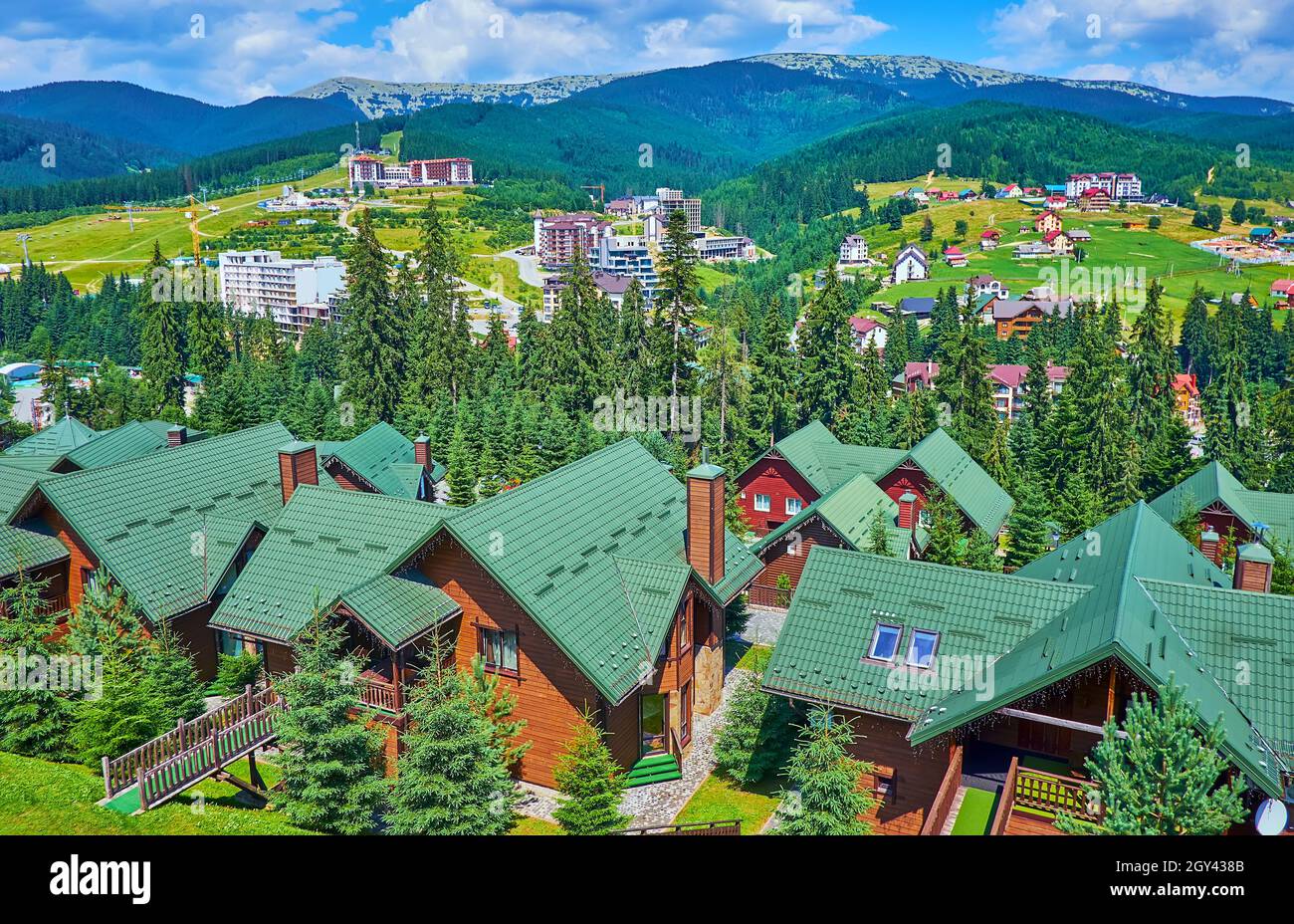 The landscape of Bukovel mountain resort from the cable car with modern ...