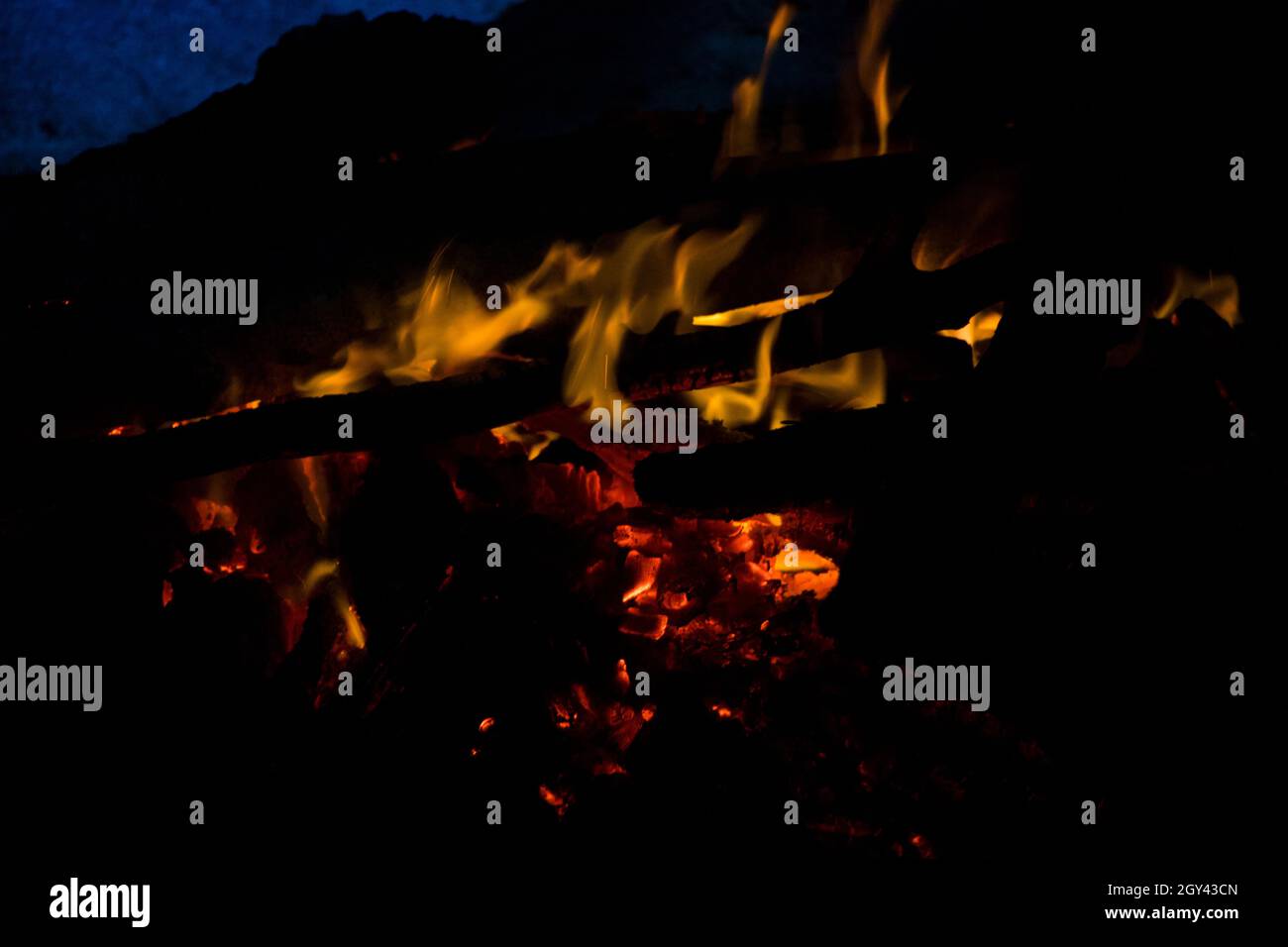 Bonfire, fire and ashe, blue and yellow colors Stock Photo - Alamy
