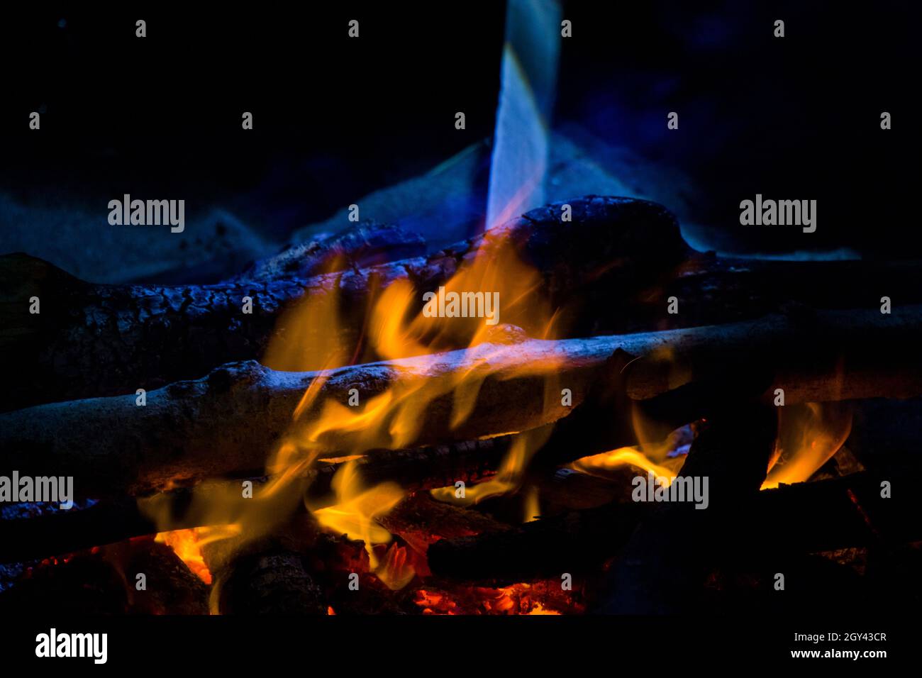Bonfire, fire and ashe, blue and yellow colors Stock Photo - Alamy