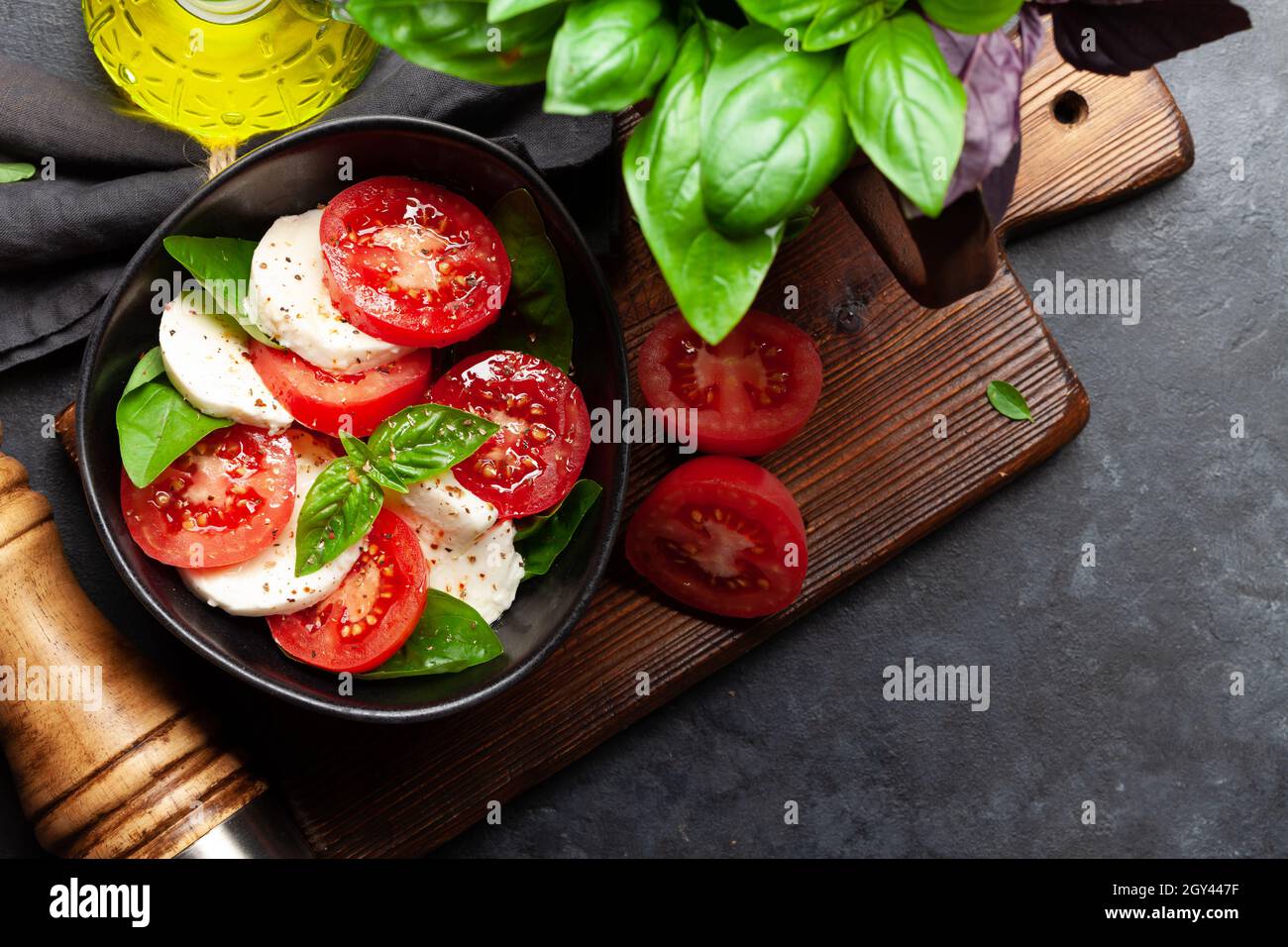 Caprese salad with fresh tomatoes, garden basil and mozzarella cheese ...