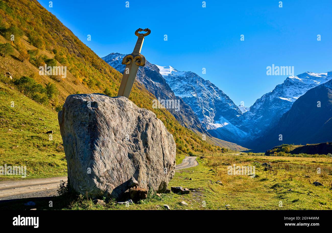 sword in a stone in the mountains Stock Photo - Alamy