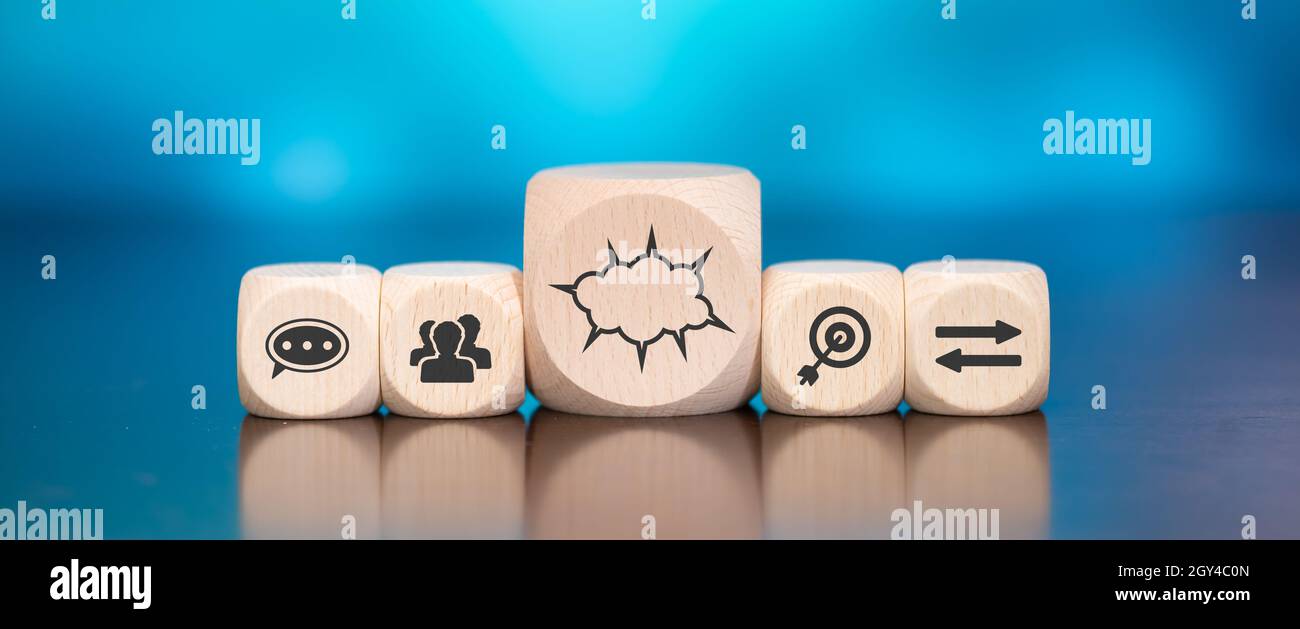 Wooden blocks with symbol of brainstorming concept on blue background ...