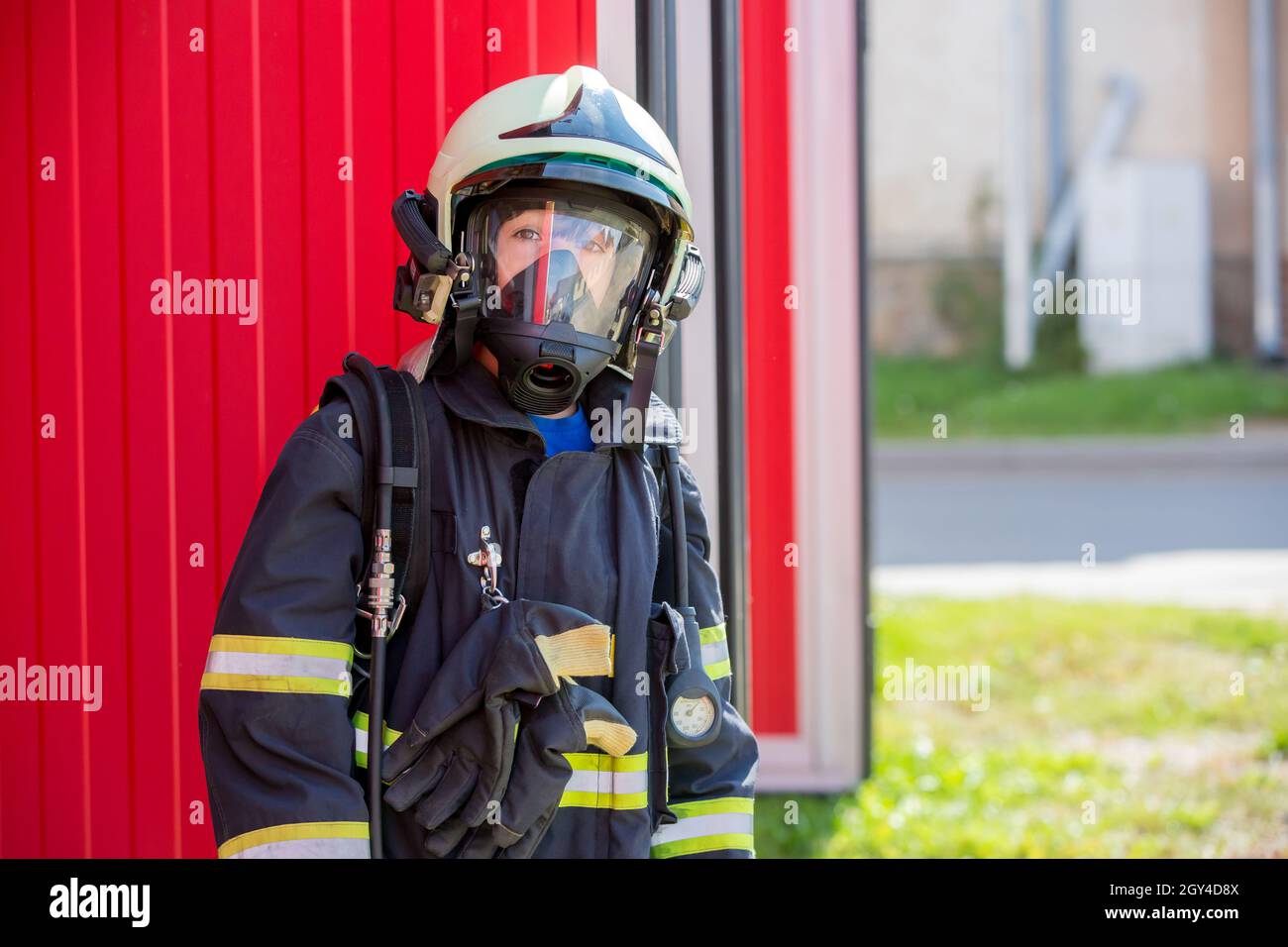 Boy wearing firefighter helmet hi-res stock photography and images - Alamy