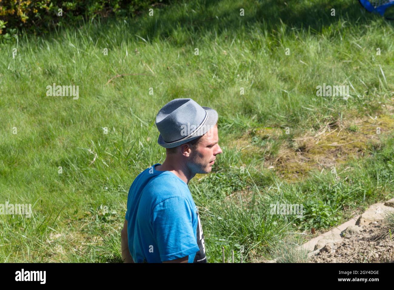 Portrait of handsome young man with modern trendy hat Stock Photo - Alamy
