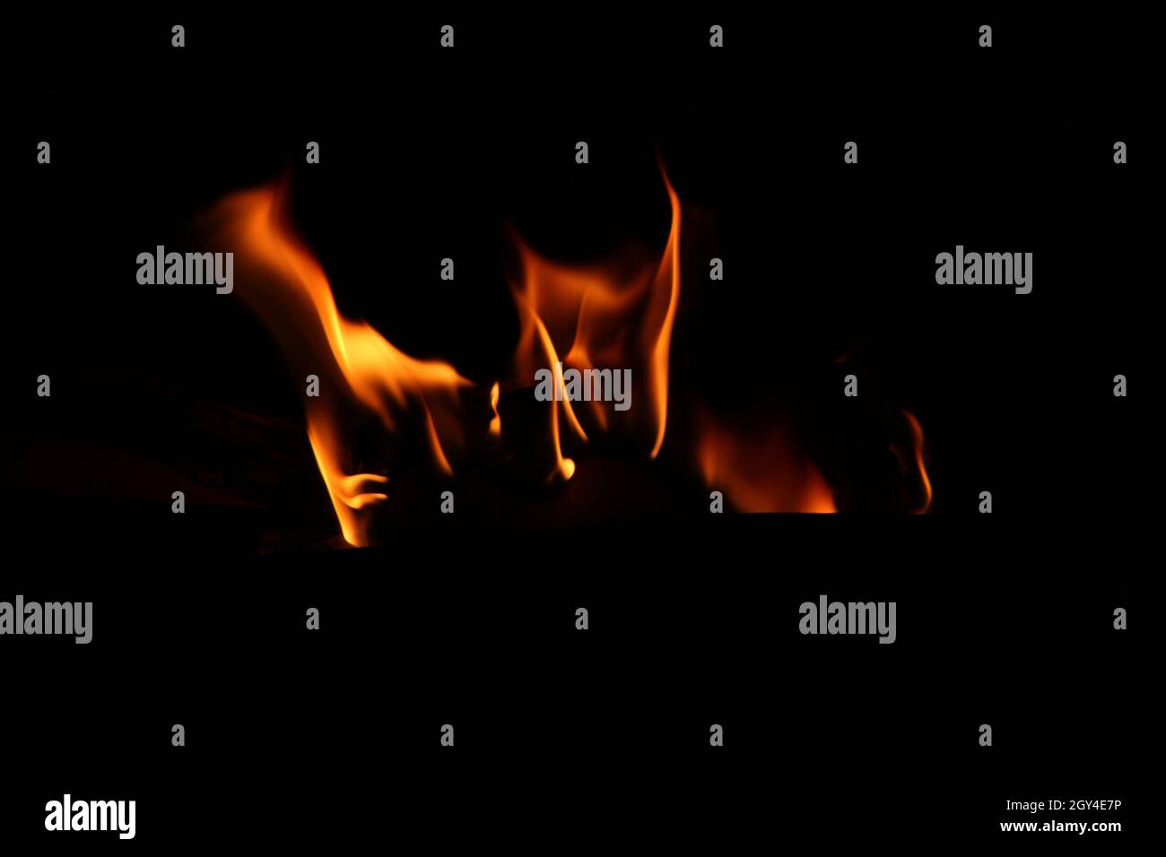 Fire flaming in the darkness Stock Photo - Alamy