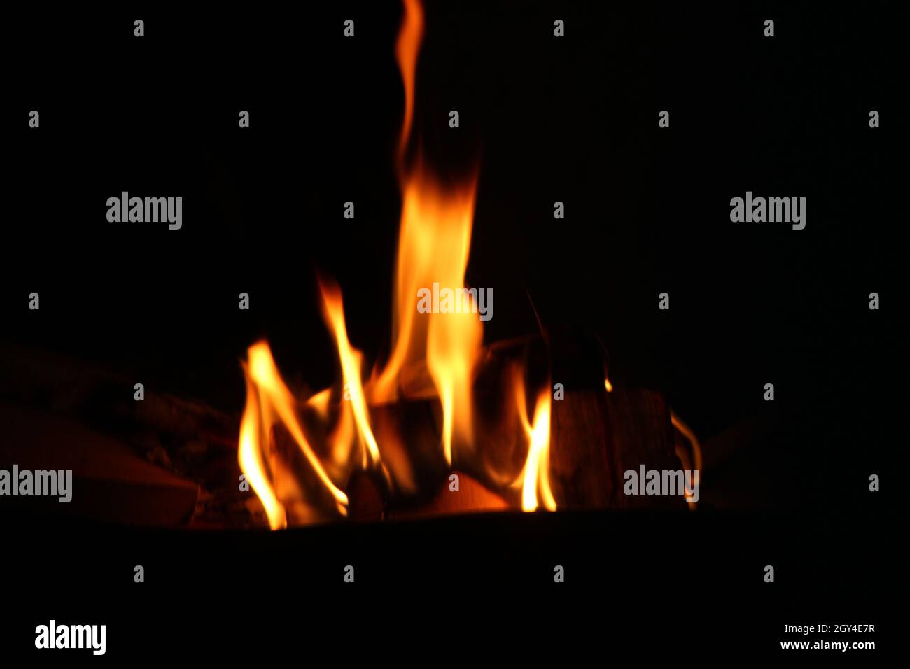 Fire flaming in the darkness Stock Photo - Alamy