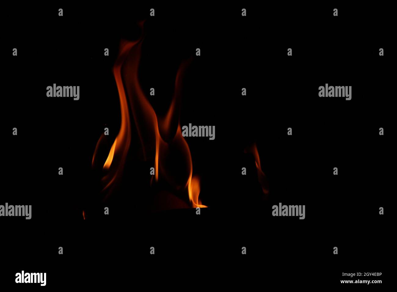 Fire flaming in the darkness Stock Photo - Alamy