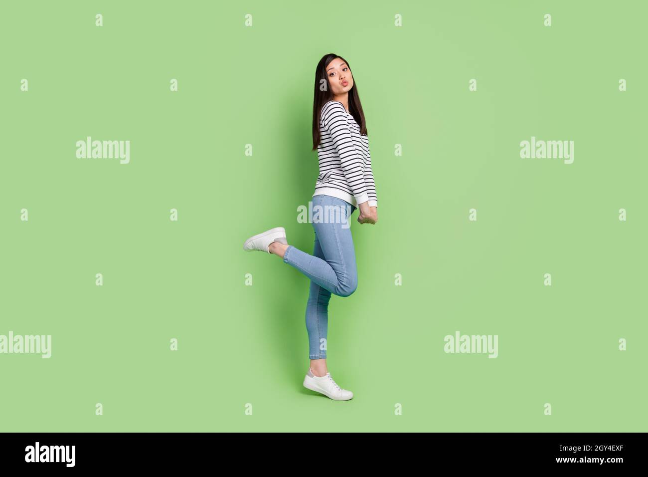 Full length body size profile side view of attractive coquettish thin ...