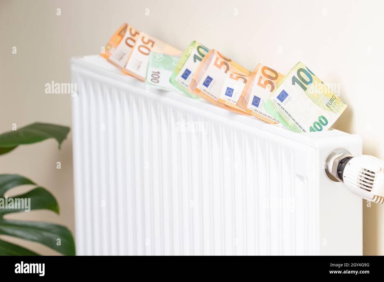 Expensive heating costs. Paying bills. Euro money banknotes on heating ...