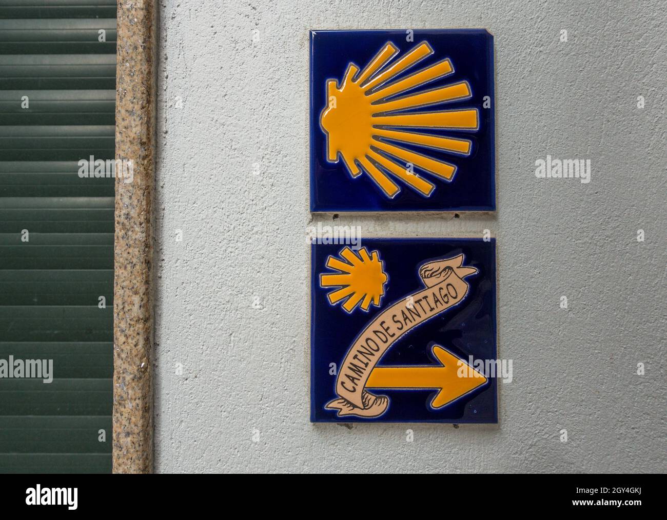 Tiles on wall signing Way of St James, direction Camino de Santiago ...