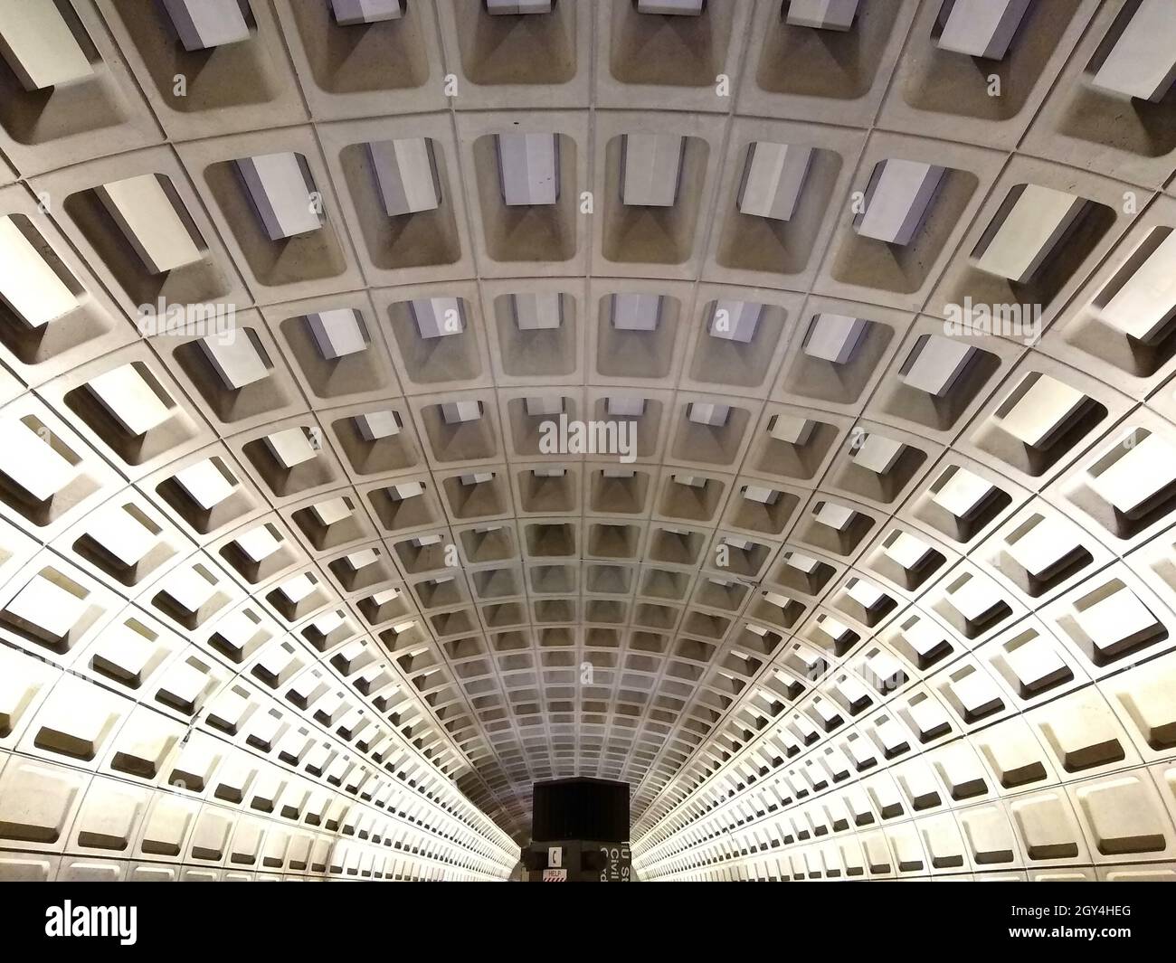 Symmetrical perspective at the futuristic architecture of the ceiling ...