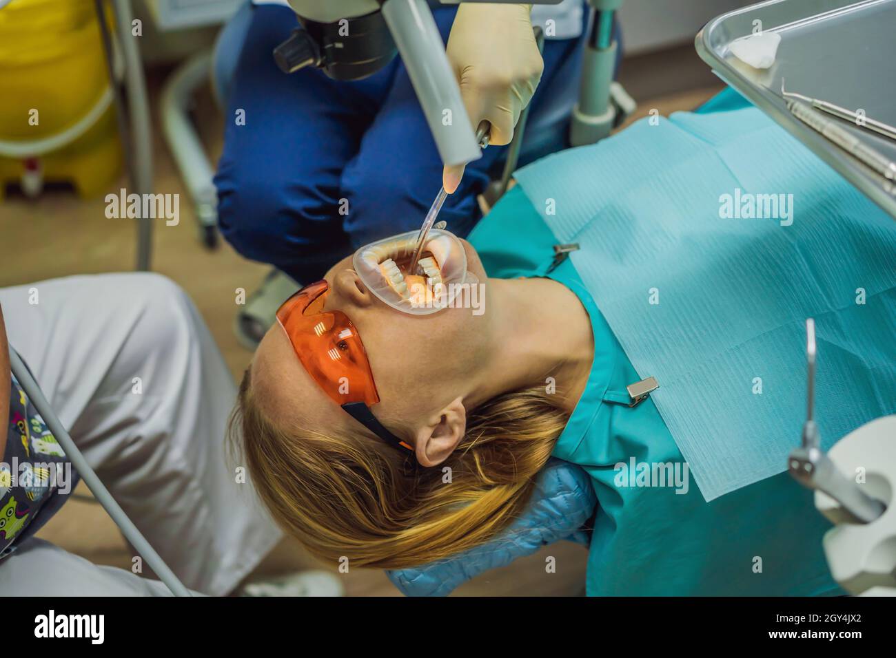 Woman having teeth examined at dentists. Dental treatment in dentistry ...