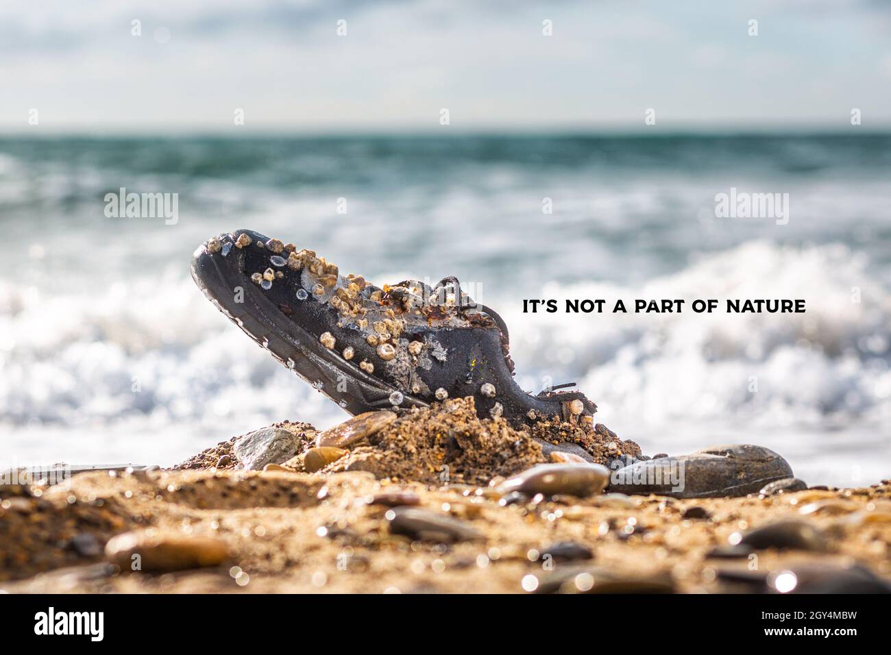 Concept of environmental protection and pollution. An old Shoe, covered ...