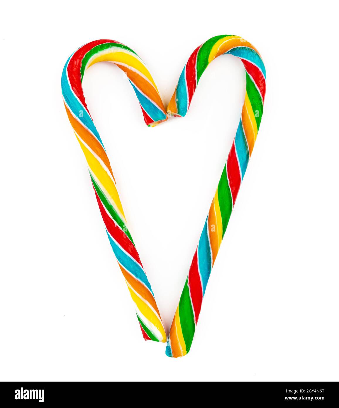 Rainbow colored candy cane isolated on white background Stock Photo - Alamy