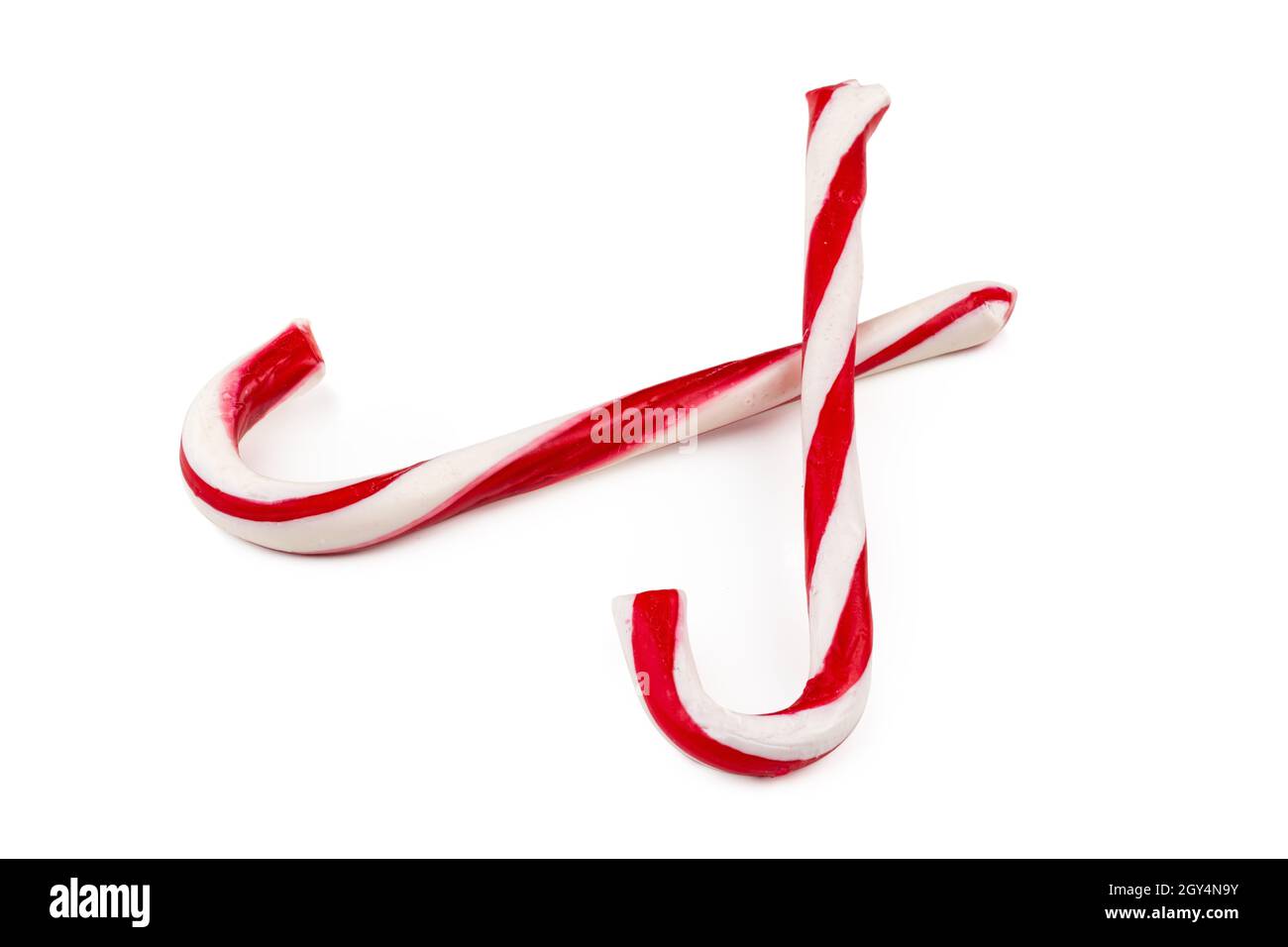 Two candy canes isolated on white background Stock Photo - Alamy