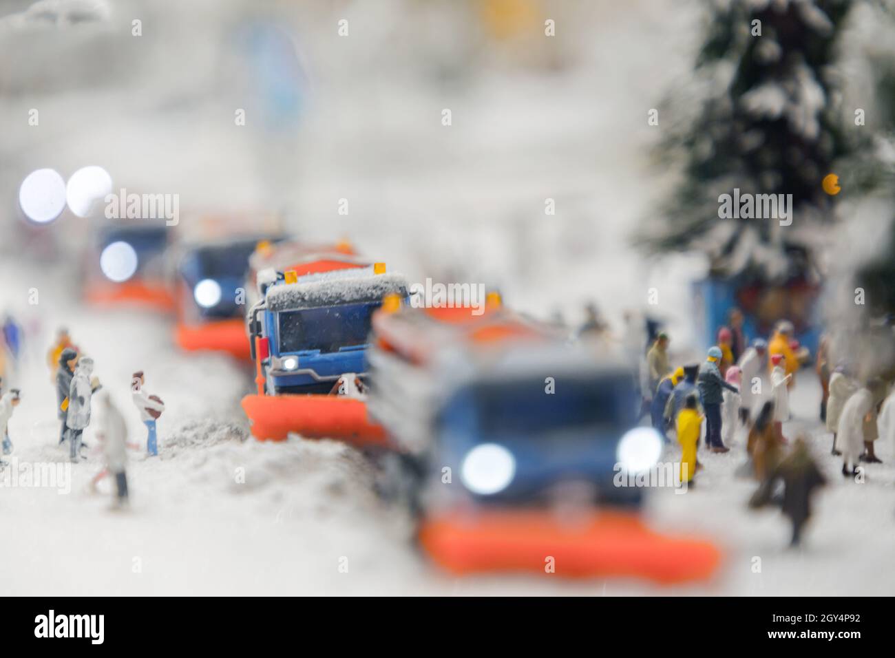 Layout of the city and small figures. Snow-covered road on which ...
