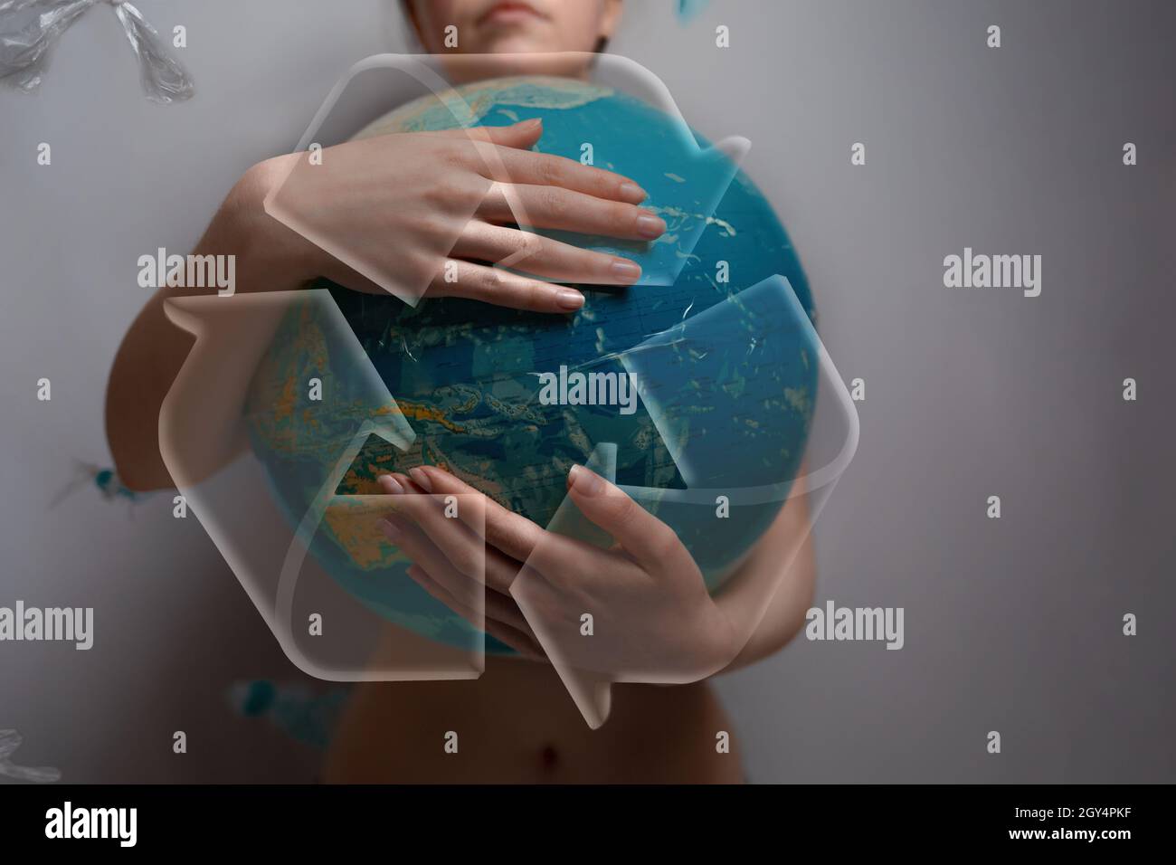 Woman embracing the globe of planet Earth. The concept of preserving ...