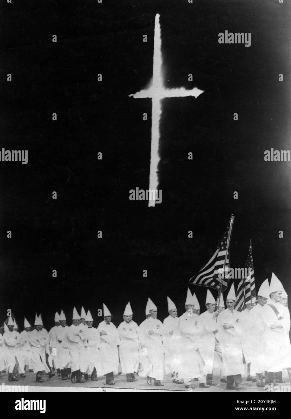 Members of the Ku Klux Klan burn a cross in Arlington, Virginia, at the ...