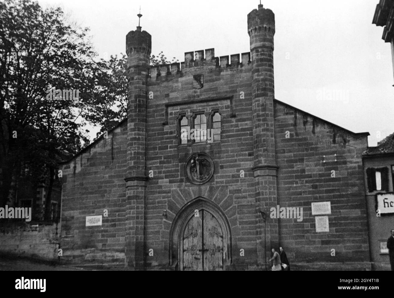 The photograph from 1934 shows the neo-Gothic Coburg riding hall. The ...