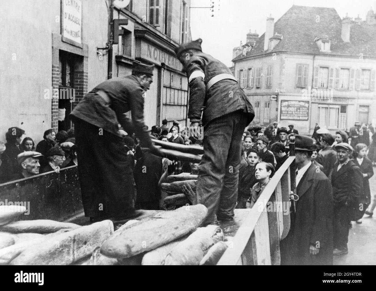 From a truck, members of the NSV (National Socialist People's Welfare ...