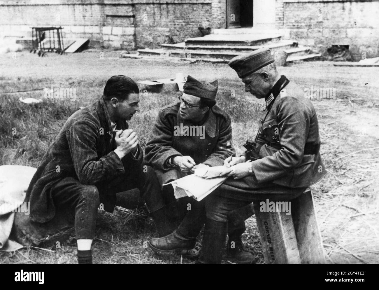 A captured British officer who has procured civilian clothes is ...