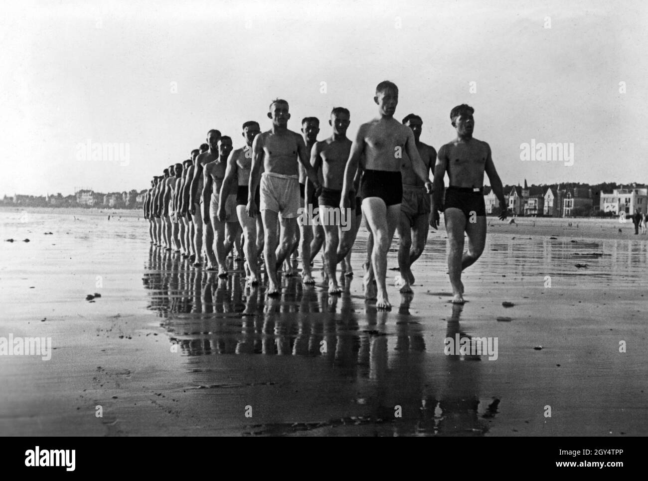 Soldiers of the German Wehrmacht bathe on the French Atlantic coast in ...