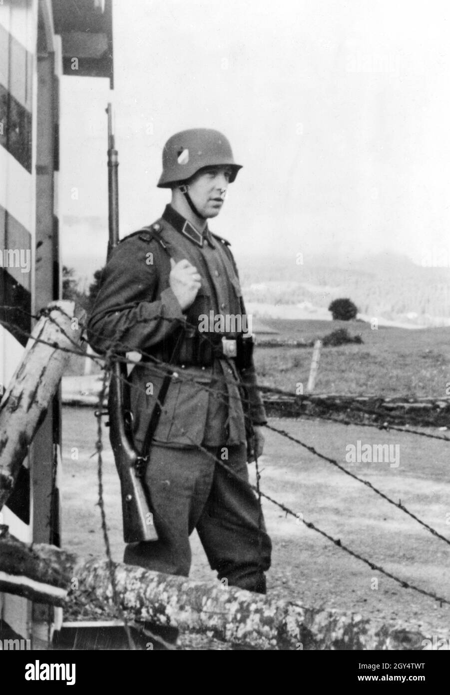 A German border guard stands guard at the French-Swiss border. (undated ...
