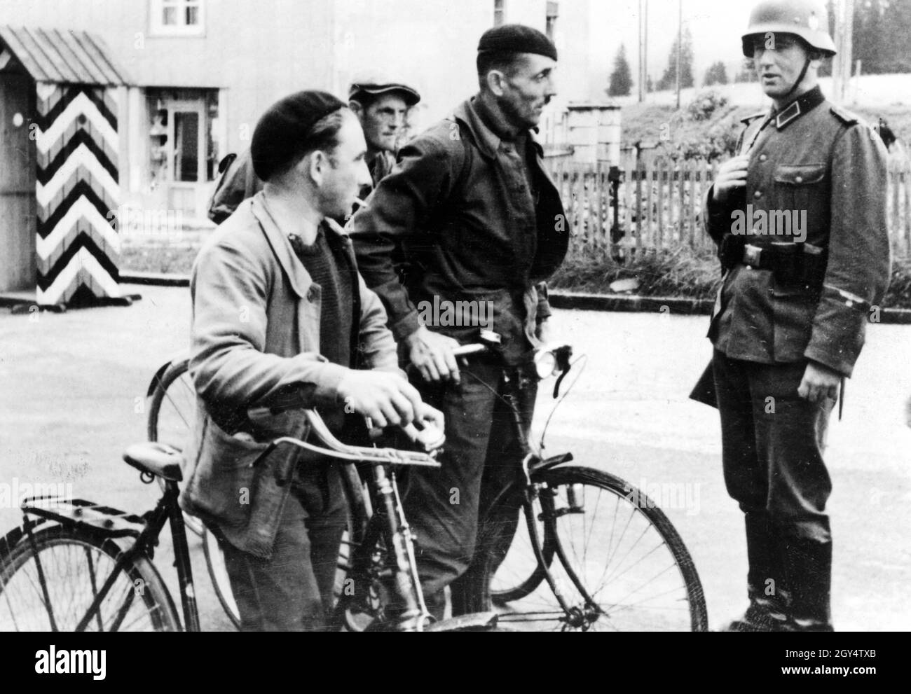 A German border guard controls border traffic at a border post on the ...