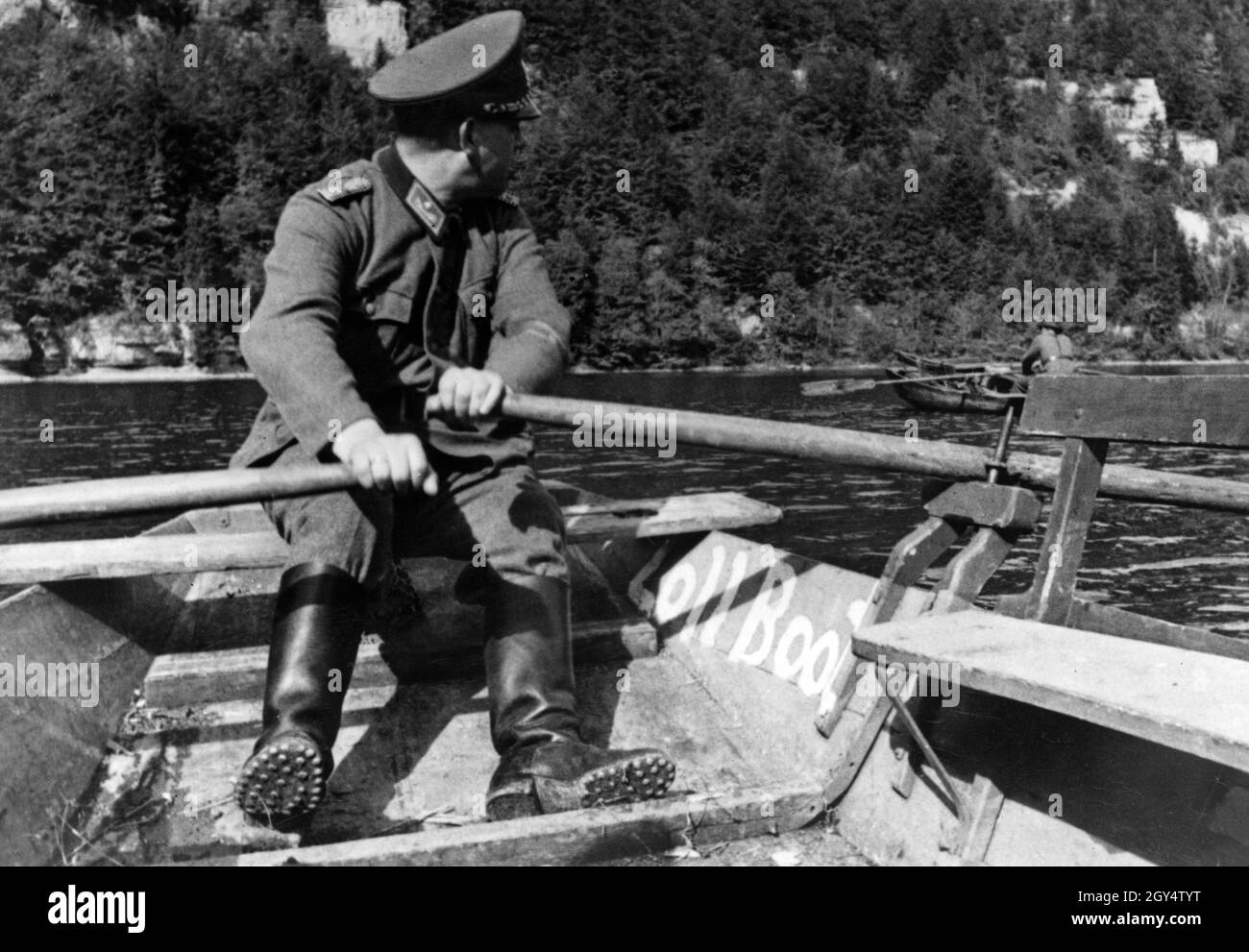 A German border guard patrols one of the border lakes on the French ...