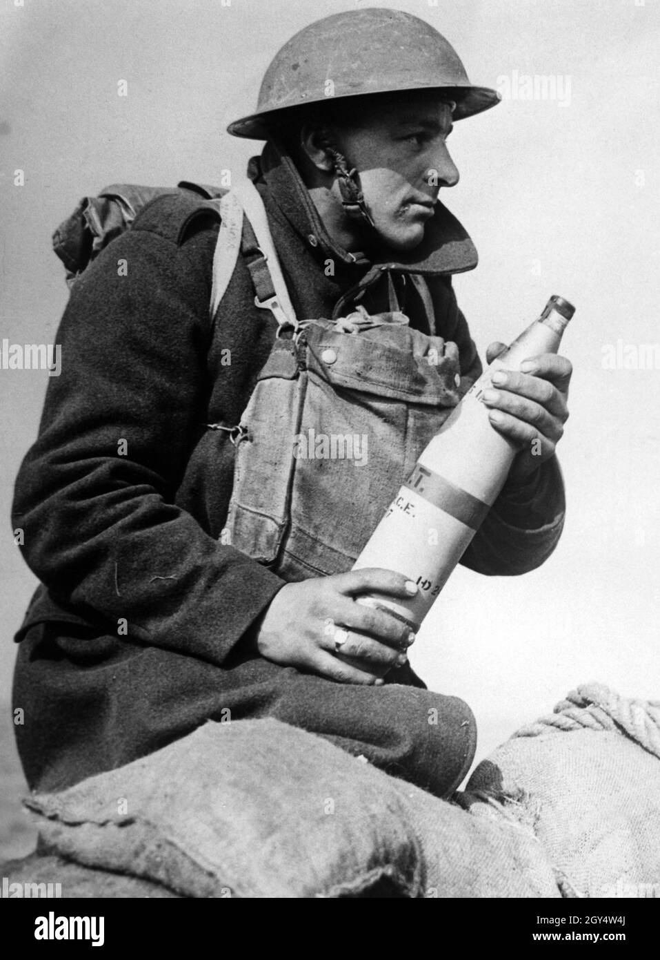 British artilleryman with a 25 pound shell during a maneuver in France ...