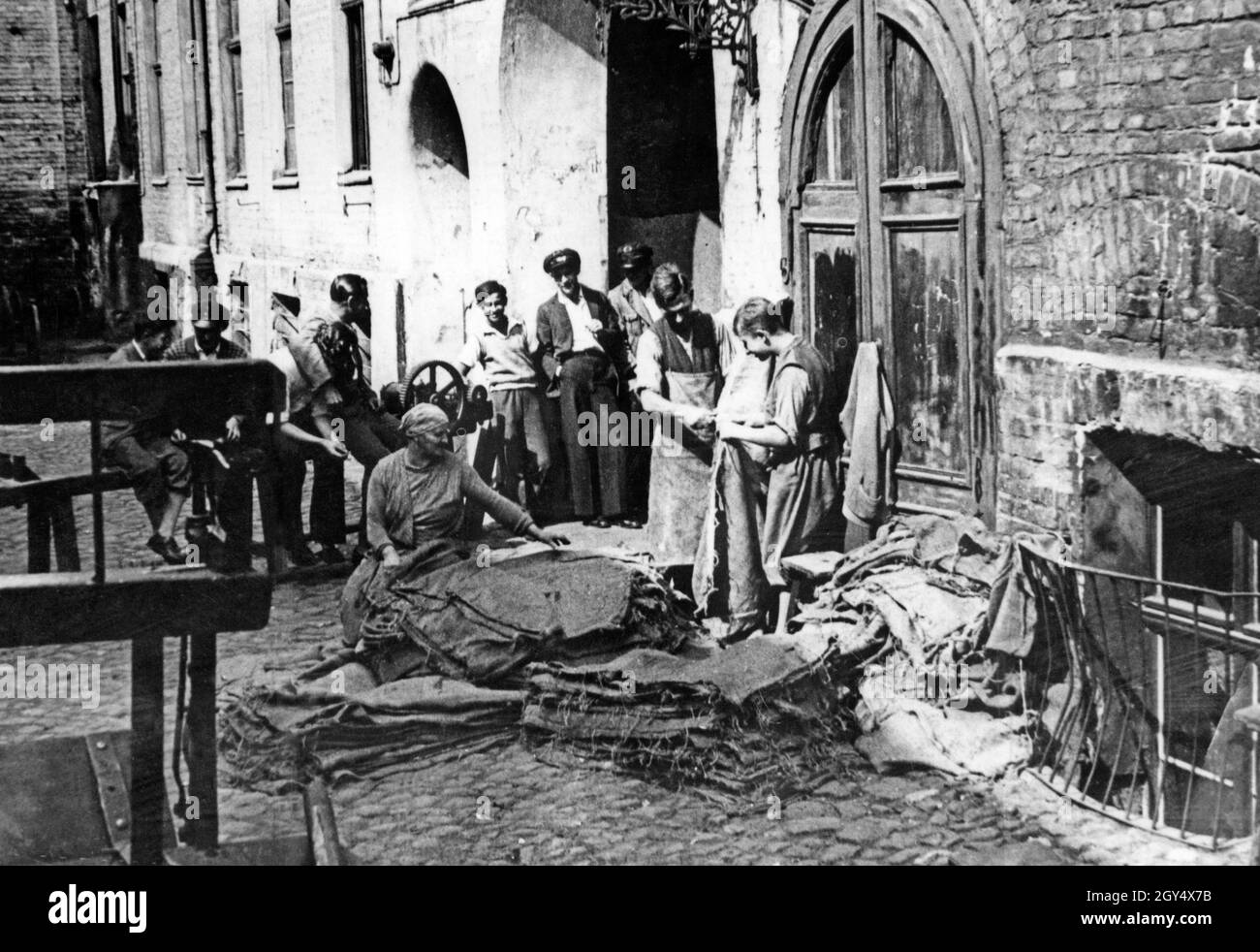 Sack sewing in a Berlin tenement. (Undated photograph) [automated ...