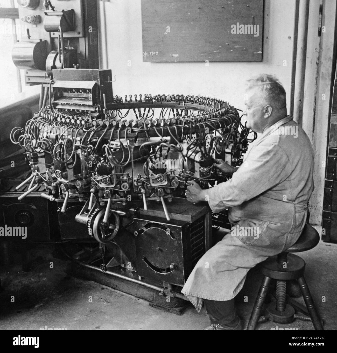Workers at the Bosch plant: magneto igniters are tested under high ...