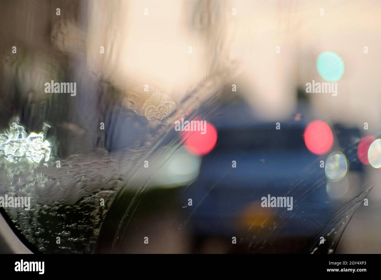 Bokeh lights and rain drops on the windshield. Abstract picture Stock ...