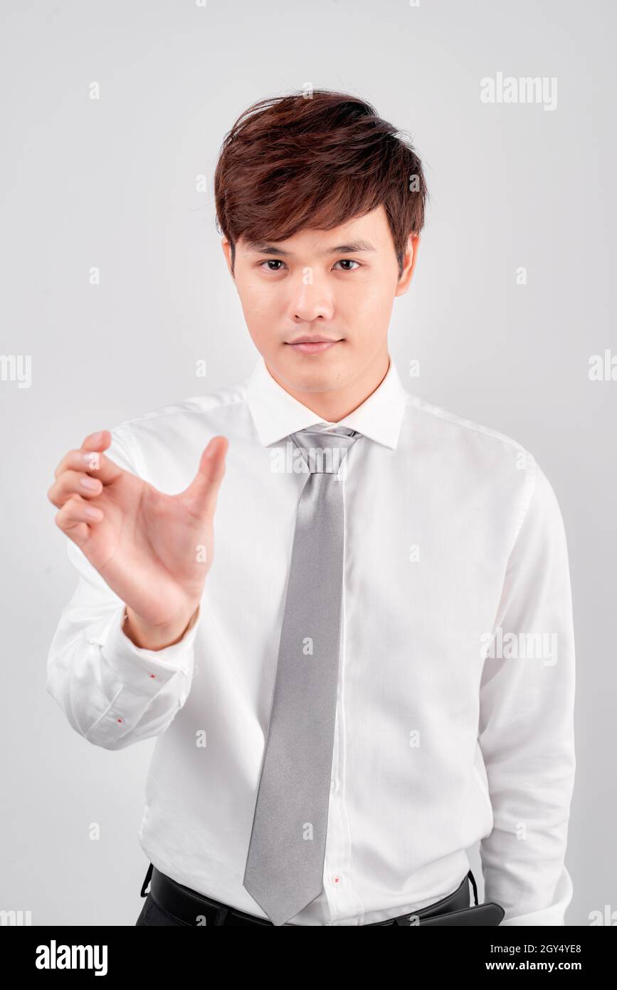 Businessman holding showing something isolated hi-res stock photography ...