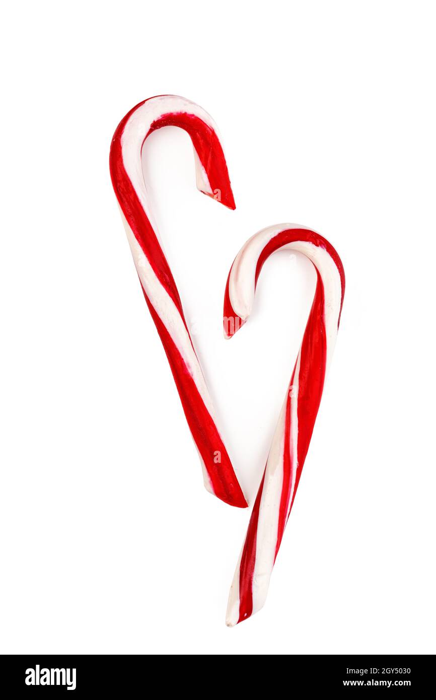 Two candy canes isolated on white background Stock Photo - Alamy