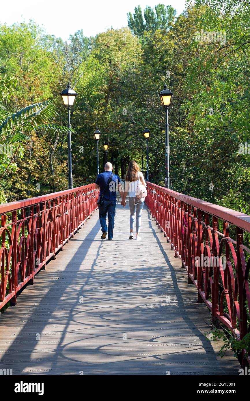 Girl crossing footbridge hi-res stock photography and images - Alamy