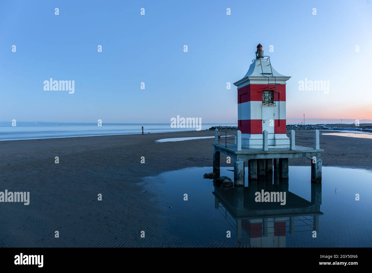 Lighthouse on the beach Stock Photo - Alamy