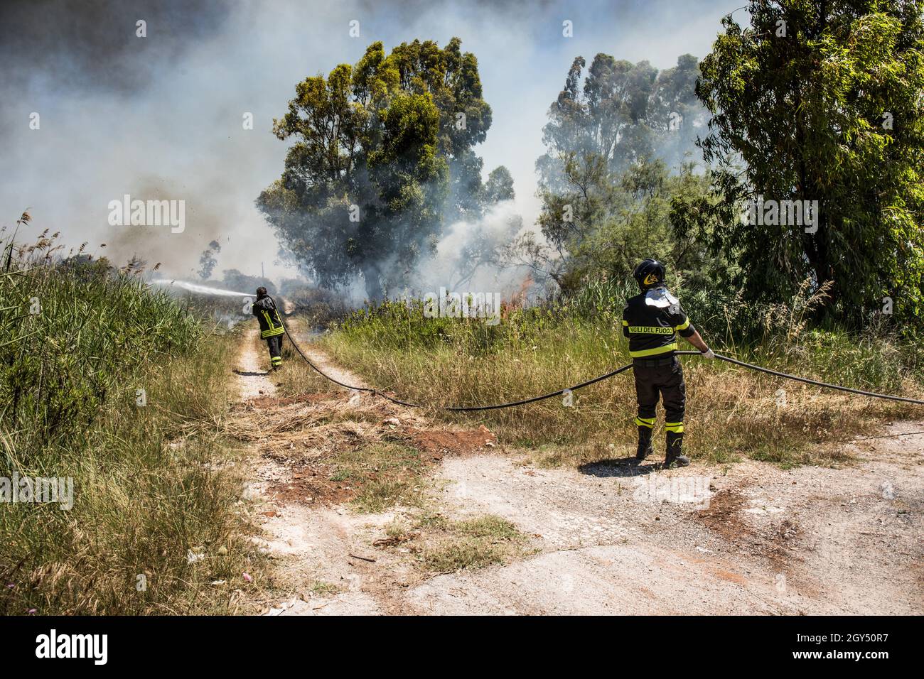 Fireman trying control fire hi-res stock photography and images - Alamy