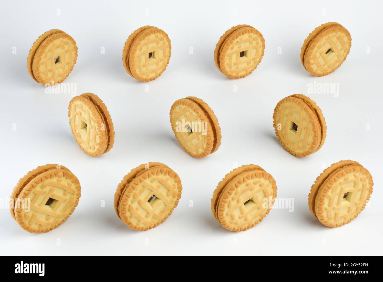 Rows of cookies stand on a white clipping background in different ...