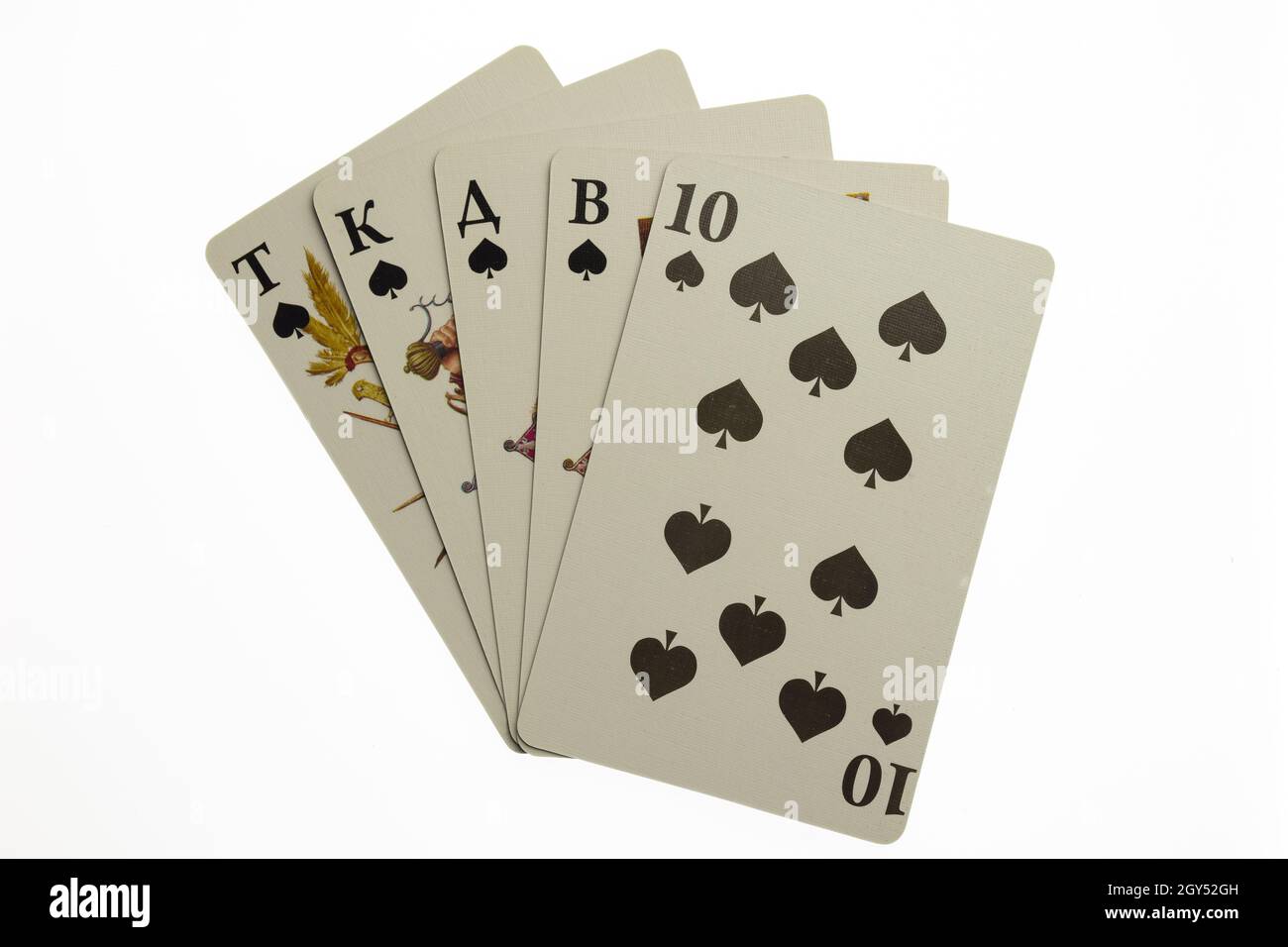 Five playing cards fanned out in the center of the frame on a white ...