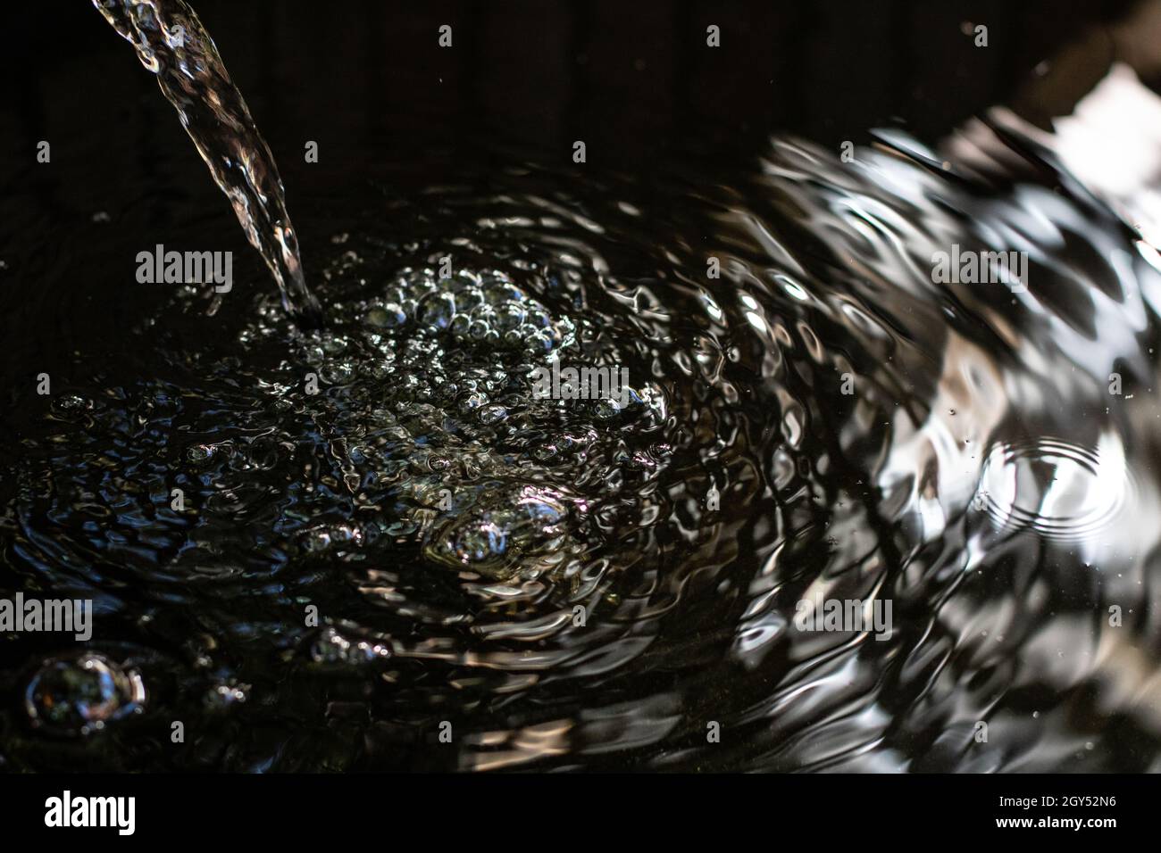 Water flowing in a pond Stock Photo - Alamy