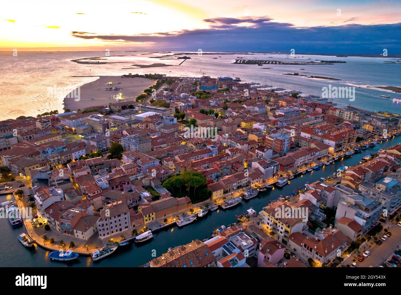 Town of Grado colorful architecture and archipelago aerial evening view ...